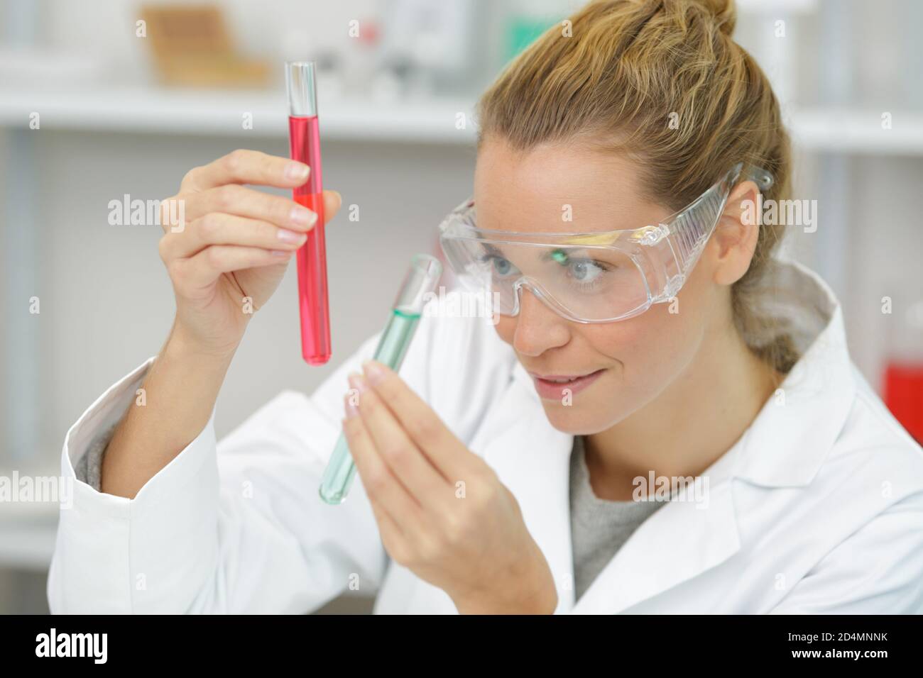 Female chemist checking blood hi-res stock photography and images - Alamy