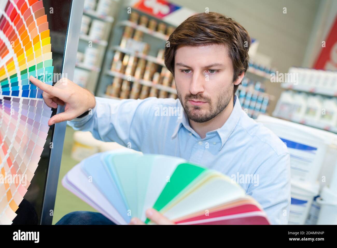 painter man with color swatches in your hand Stock Photo - Alamy