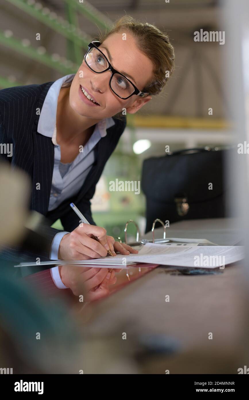 Female office worker taking note hi-res stock photography and images ...