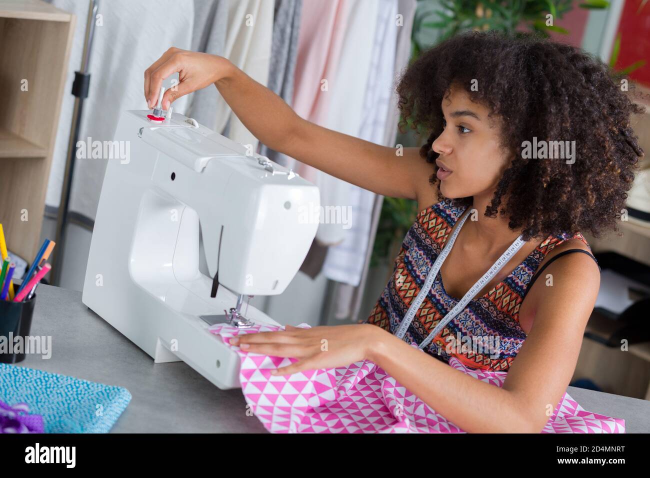 sewing dress on the sewing machine Stock Photo - Alamy