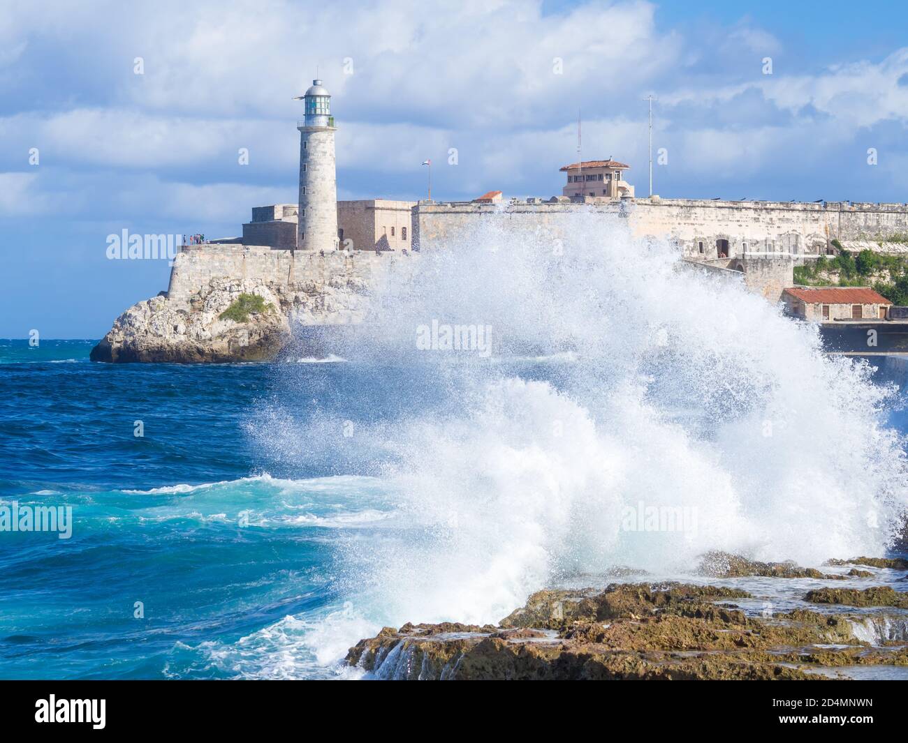 El Morro castle in Havana with sea waves crashing on the Malecon ...