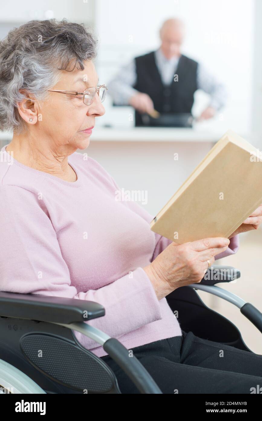 the old gray-haired woman reading a book Stock Photo - Alamy