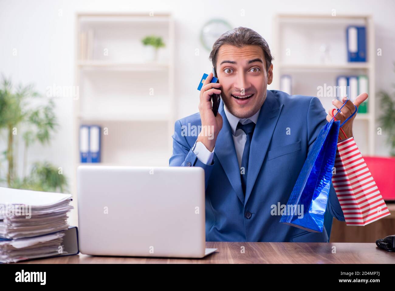 Young male businessman in the ecommerce concept Stock Photo - Alamy