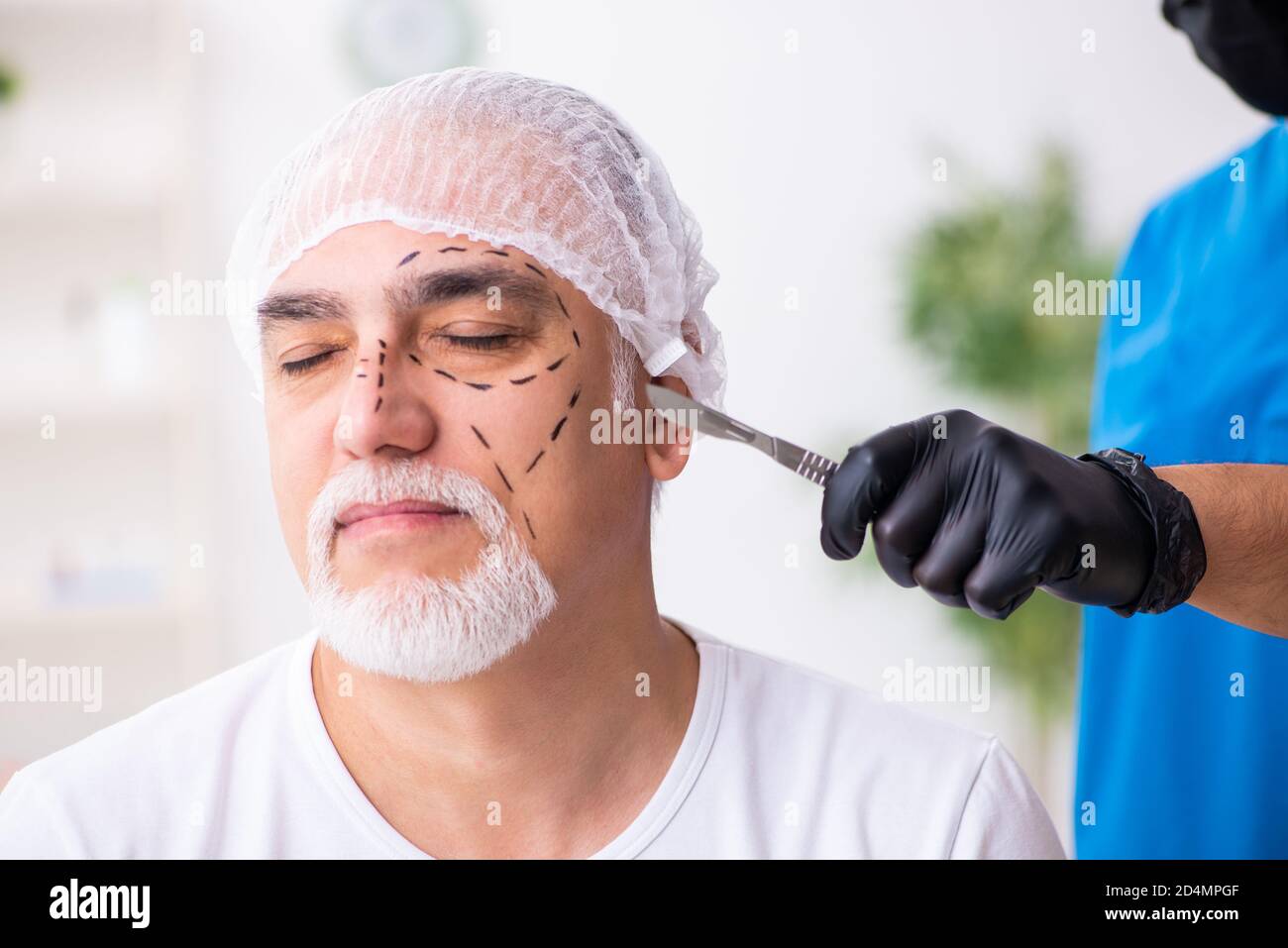 Old man visiting doctor for plastic surgery Stock Photo - Alamy
