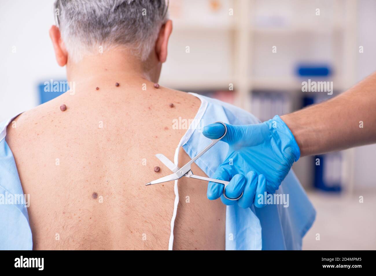 Old man visiting male doctor dermatologist Stock Photo - Alamy