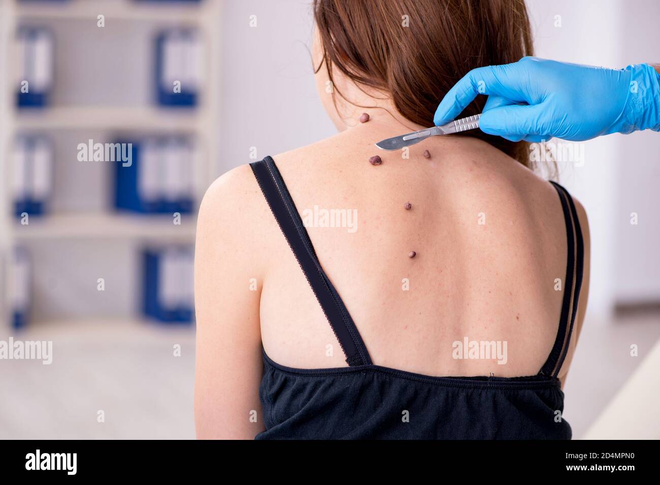 Young woman visiting doctor dermatologist Stock Photo - Alamy