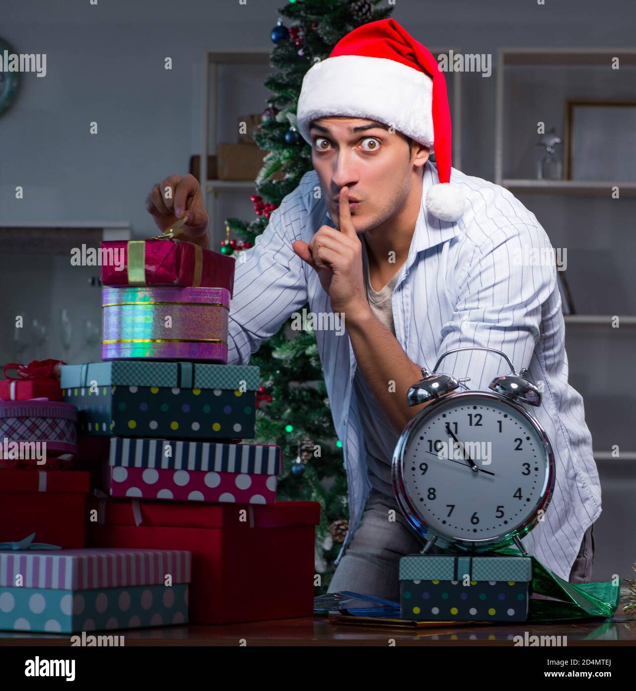 The man with many christmas gifts in boxes Stock Photo - Alamy