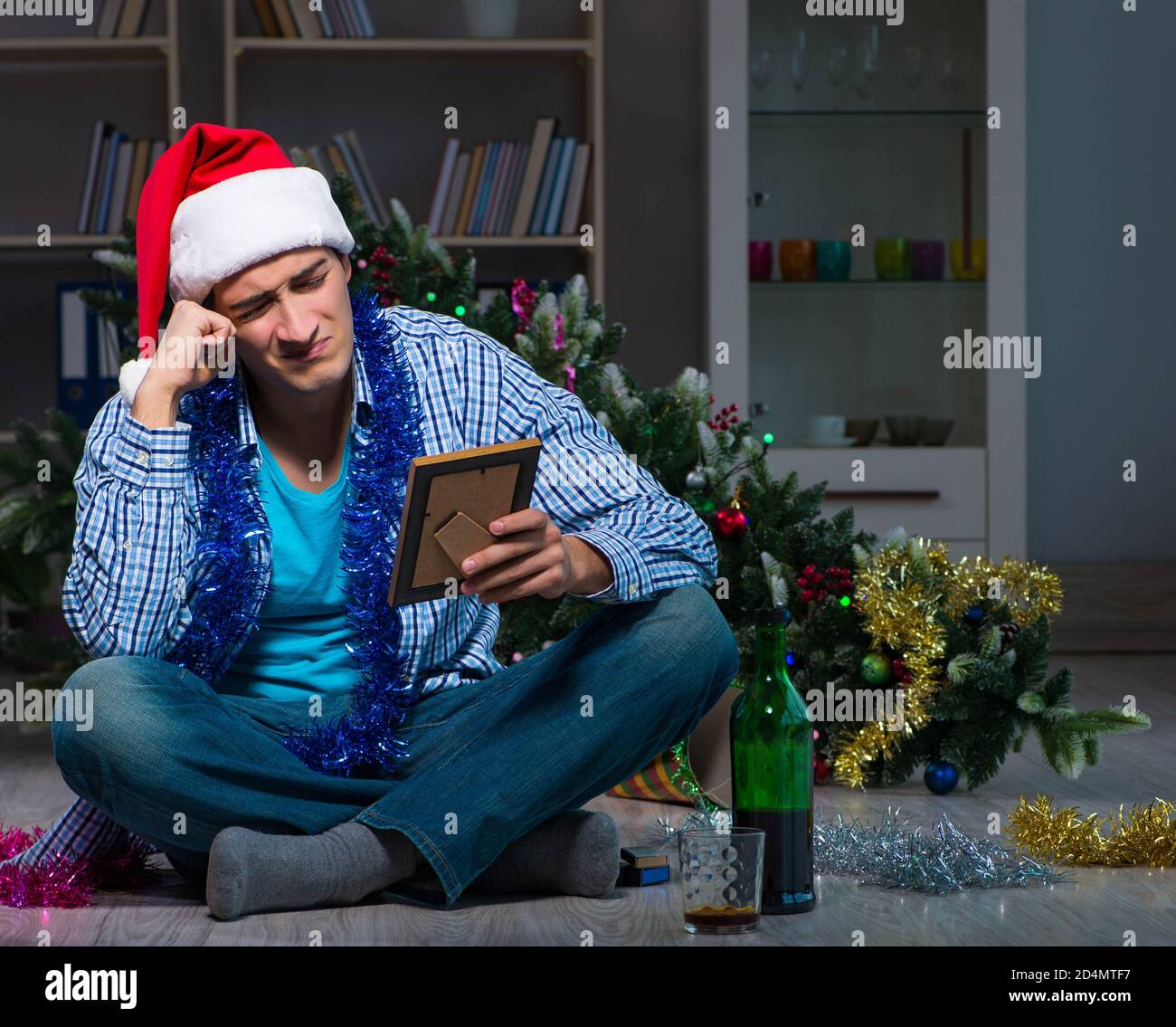 The man celebrating christmas at home alone Stock Photo - Alamy