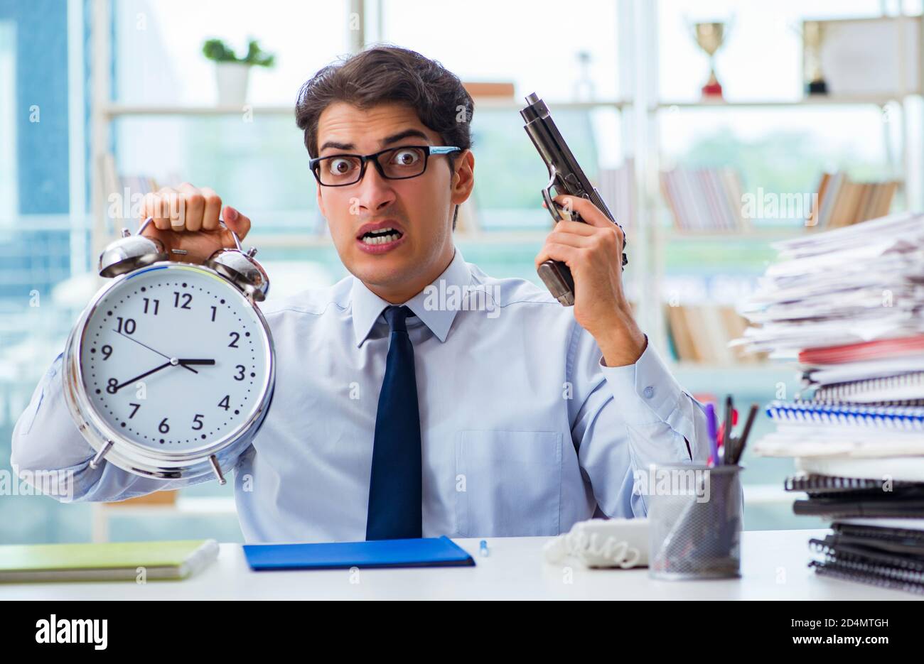 The angry businessman with gun thinking of committing suicide Stock ...