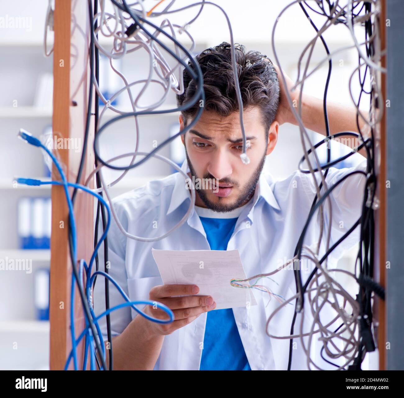The computer repairman working on repairing network in it workshop ...