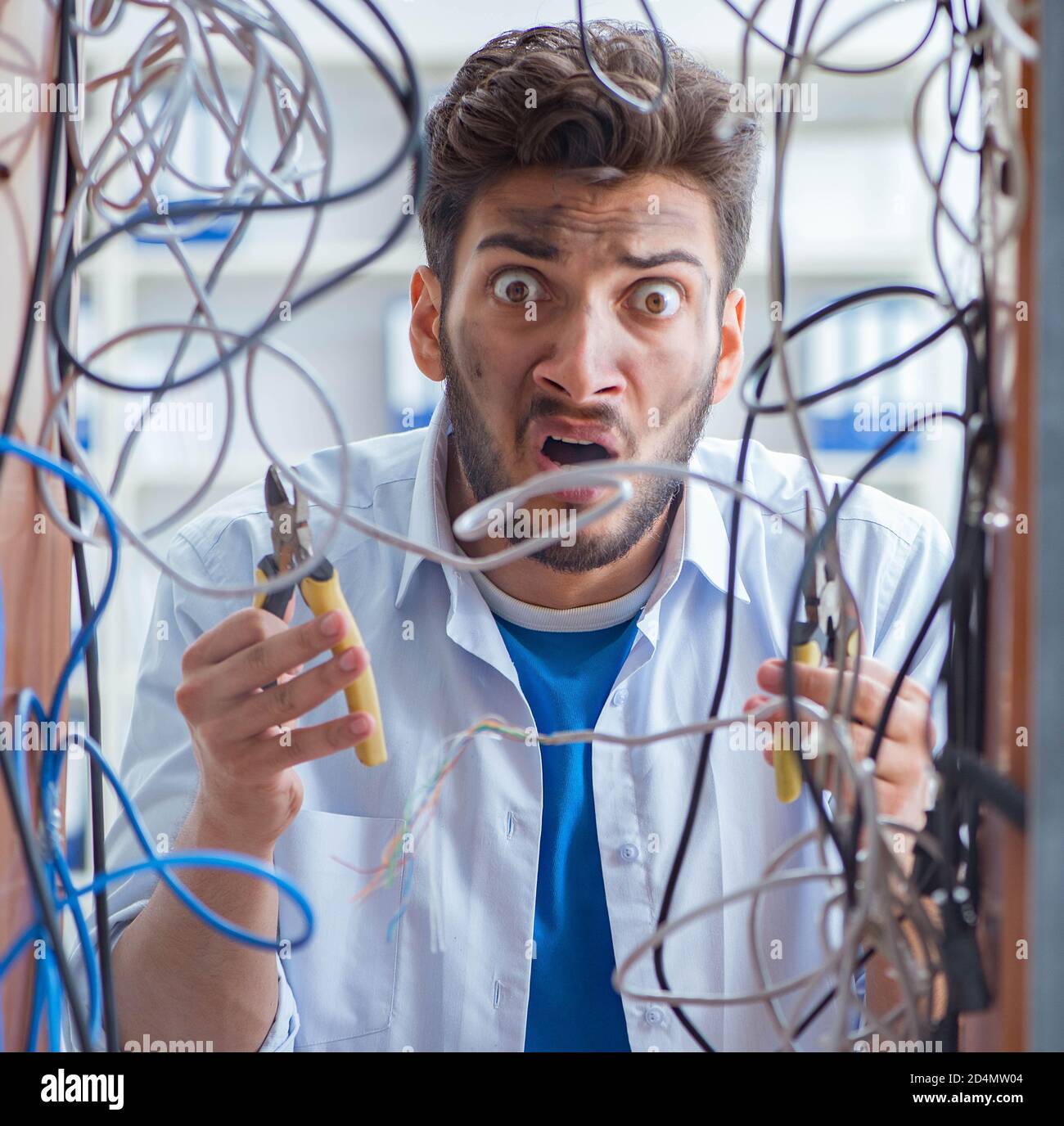 The computer repairman working on repairing network in it workshop ...