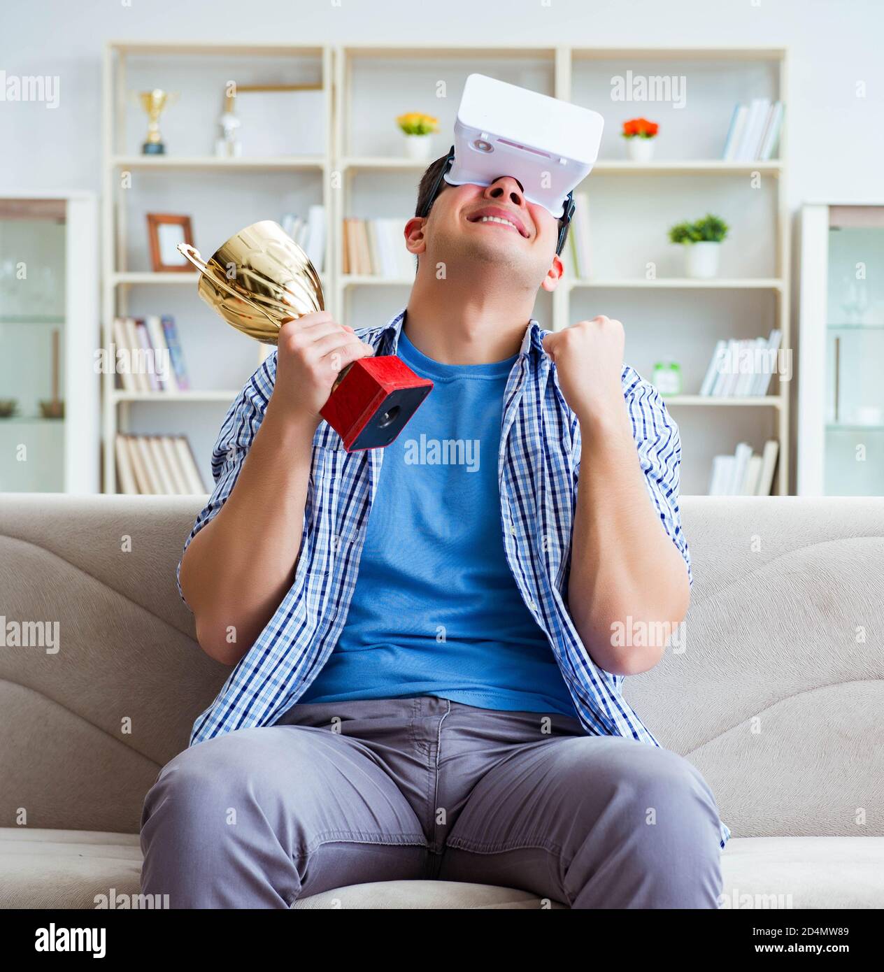 The man wearing virtual reality vr glasses receiving prize cup award ...