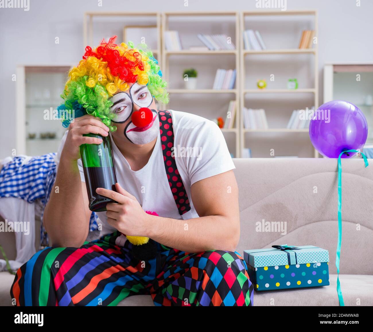 The drunk clown celebrating having a party at home Stock Photo - Alamy
