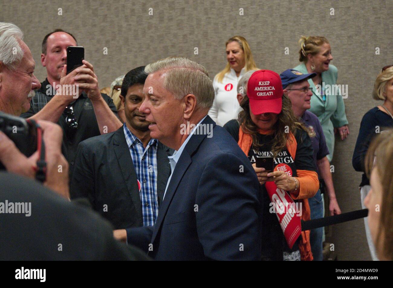 South Carolina Senator Lindsey Graham shakes hands with rally attendees ...