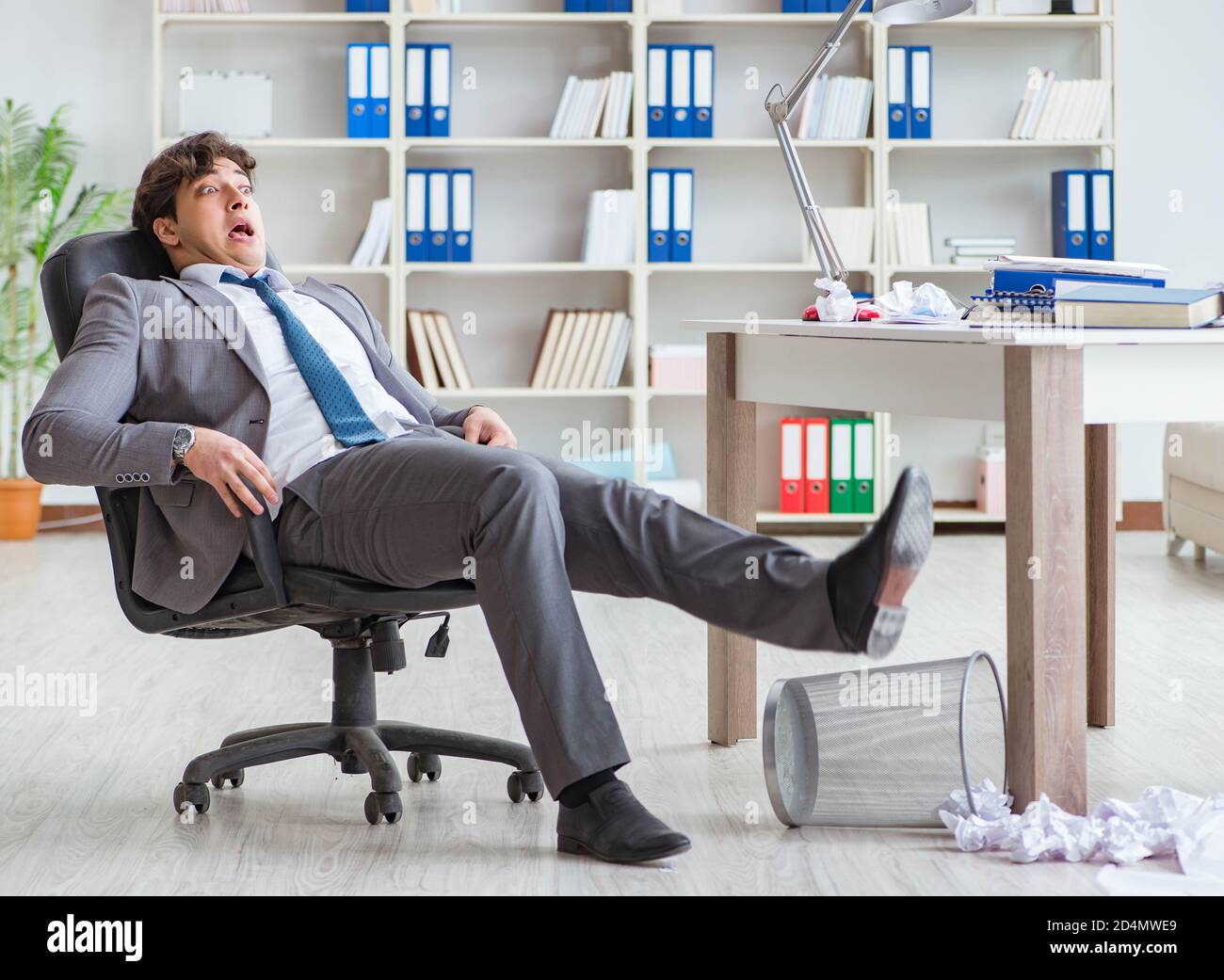 Businessman having fun taking a break in the office at work Stock Photo ...