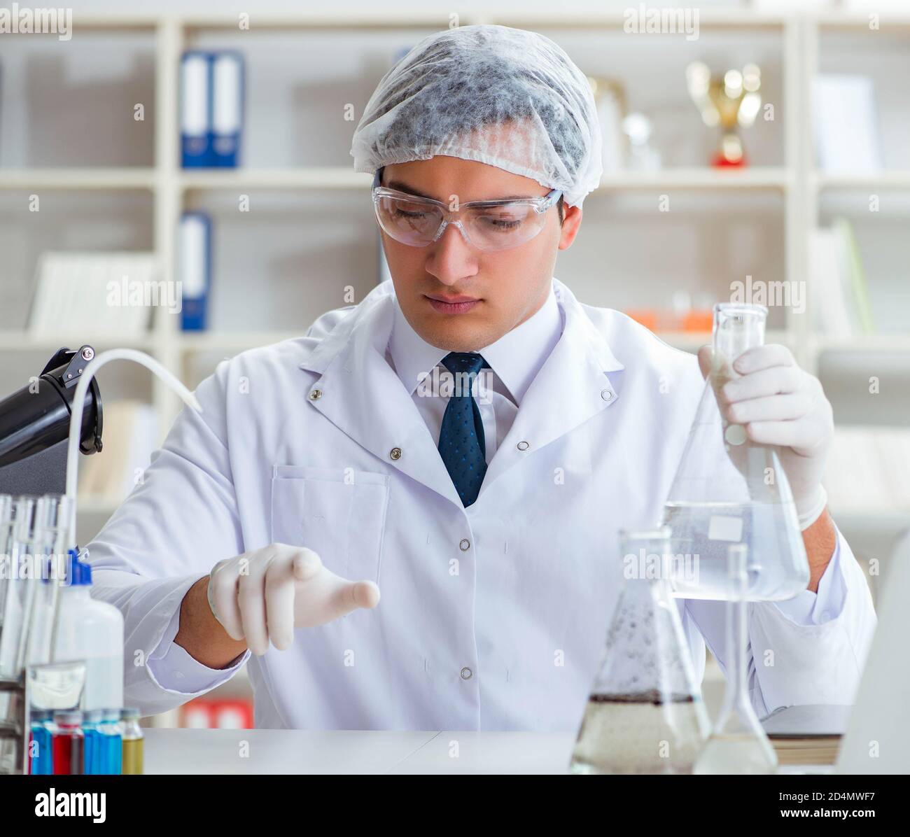 Young researcher scientist doing a water test contamination experiment ...