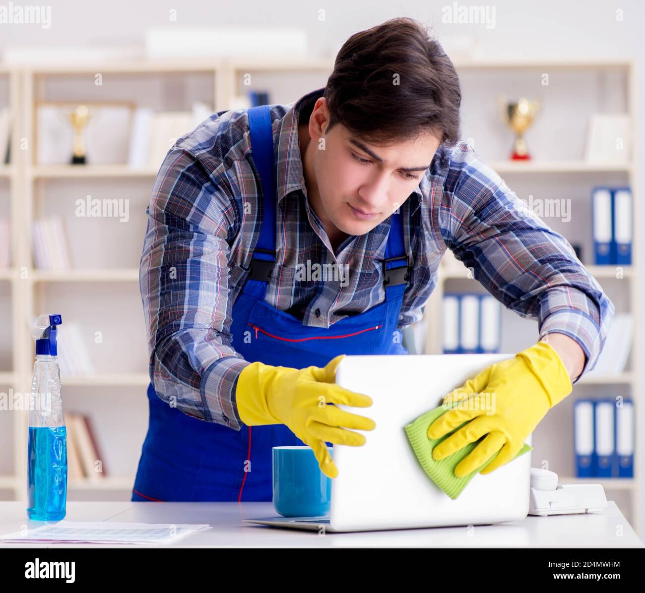 Male cleaner working in the office Stock Photo - Alamy