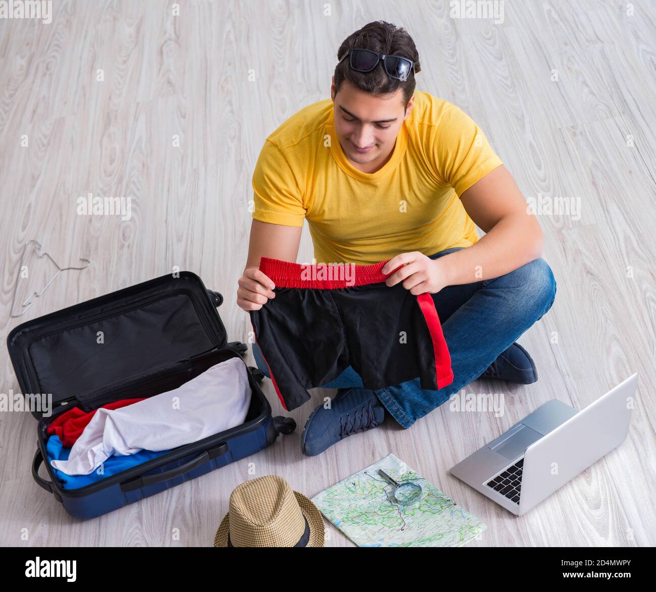 Man planning his vacation trip with map Stock Photo - Alamy