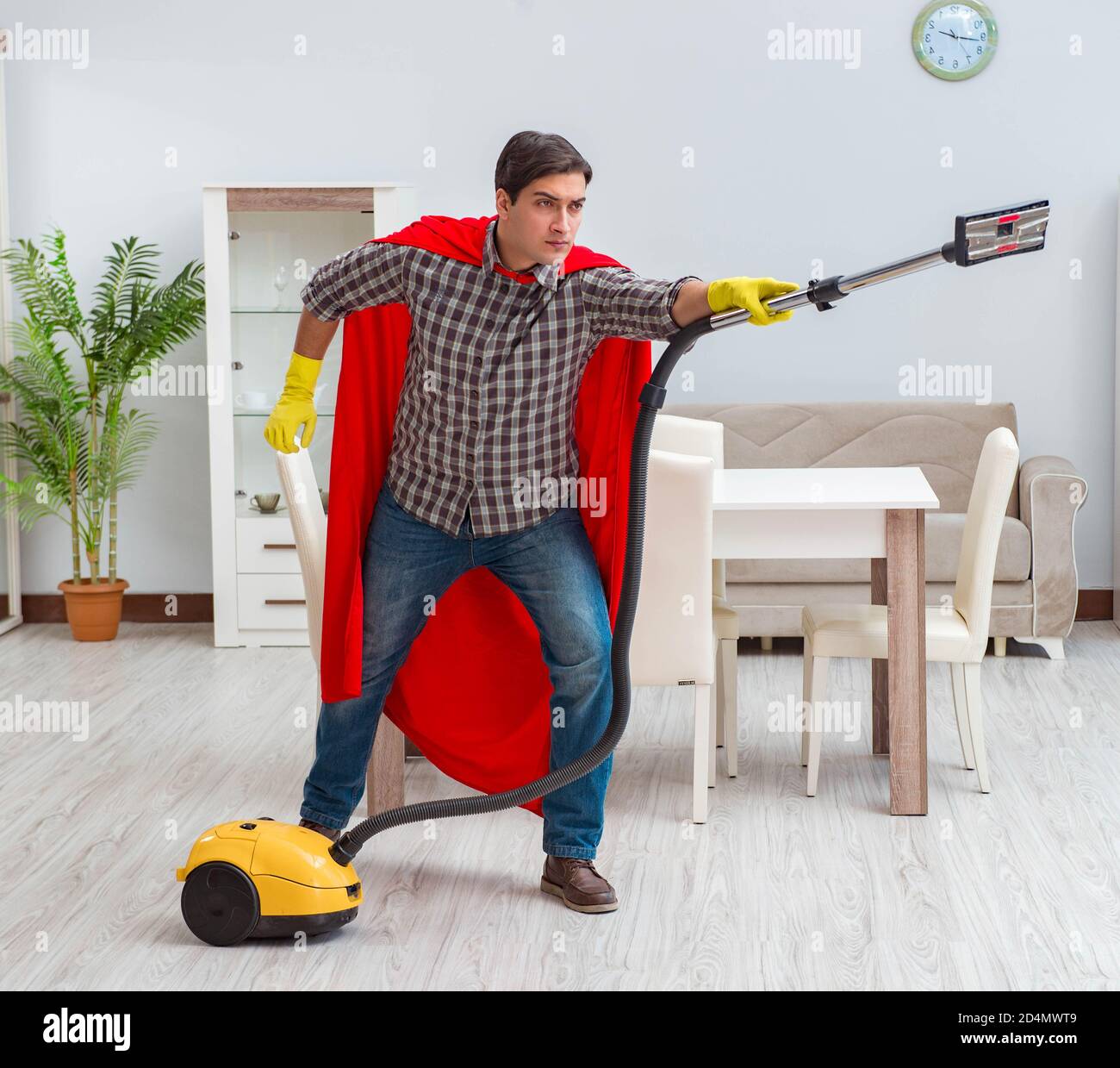 The super hero cleaner working at home Stock Photo - Alamy