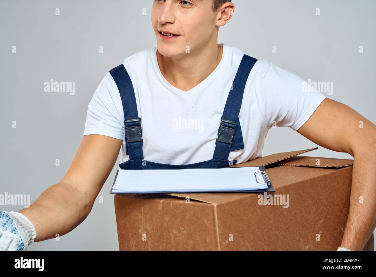 Man worker with box in hands delivery loading service packing service ...