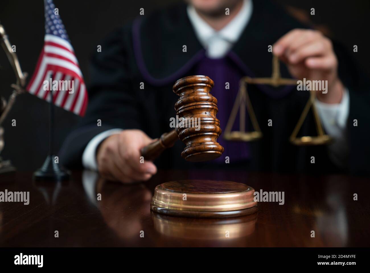 American judge in the courtroom. Gavel, penal code and scale on the ...