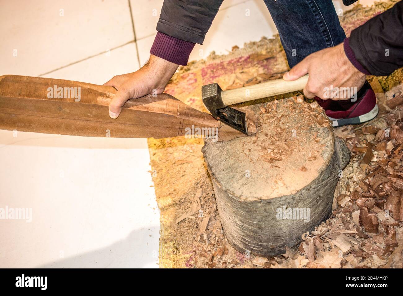 Person cutting wood and making wooden figures Stock Photo - Alamy
