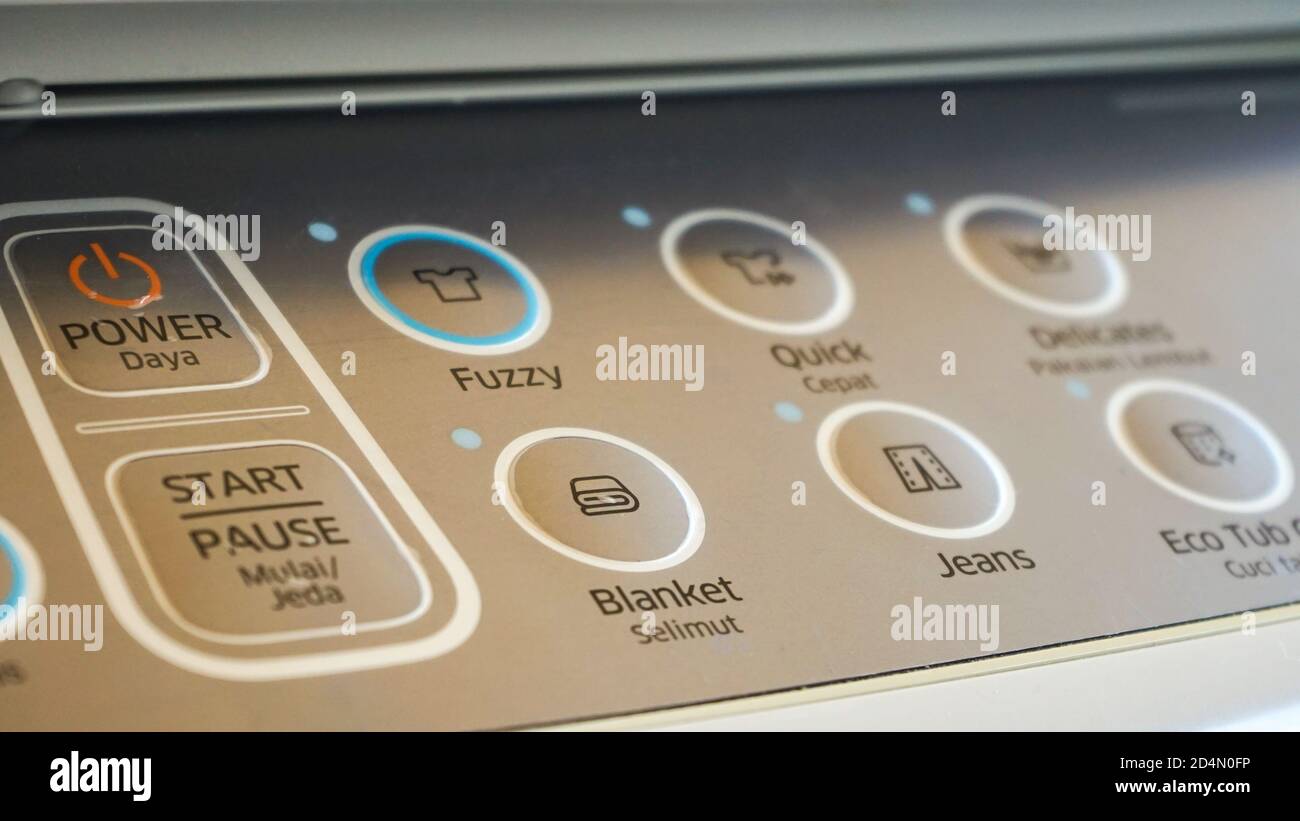 Close up button of the clothes washer Stock Photo - Alamy