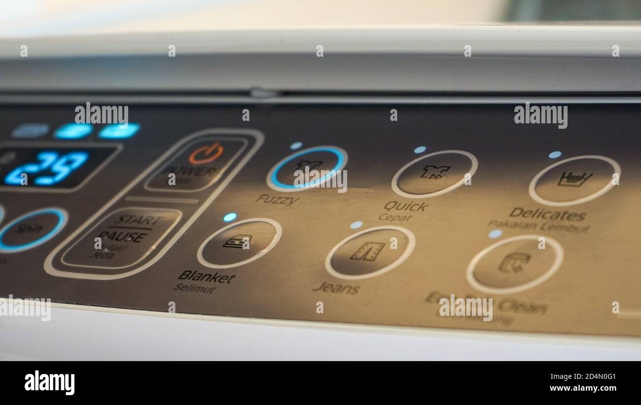 Close up button of the clothes washer Stock Photo - Alamy