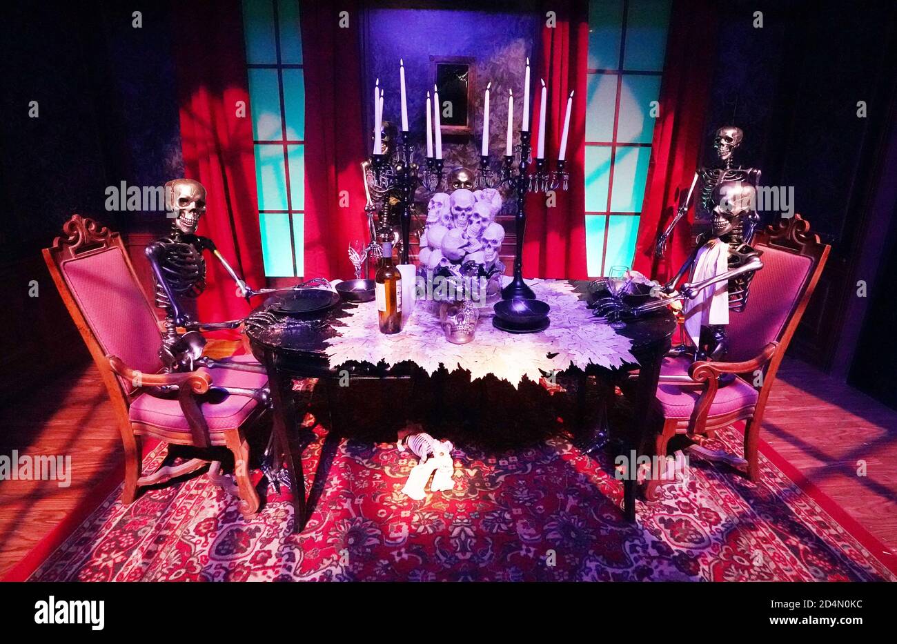 St. Louis, United States. 09th Oct, 2020. A dinner table of skeletons ...
