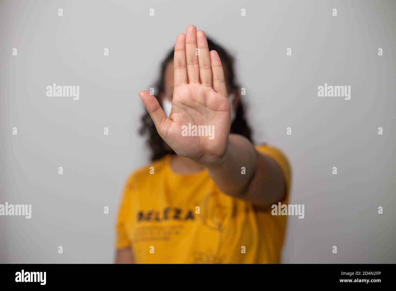 Person holding their hand in front of their face gesturing stop Stock ...
