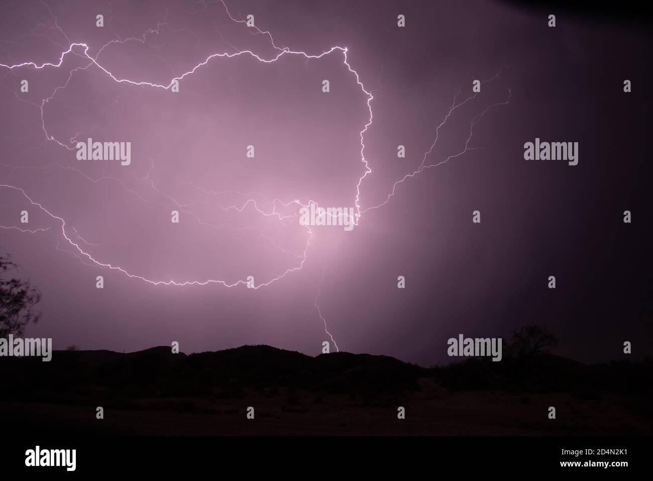 Lightning over mountains at night Stock Photo - Alamy
