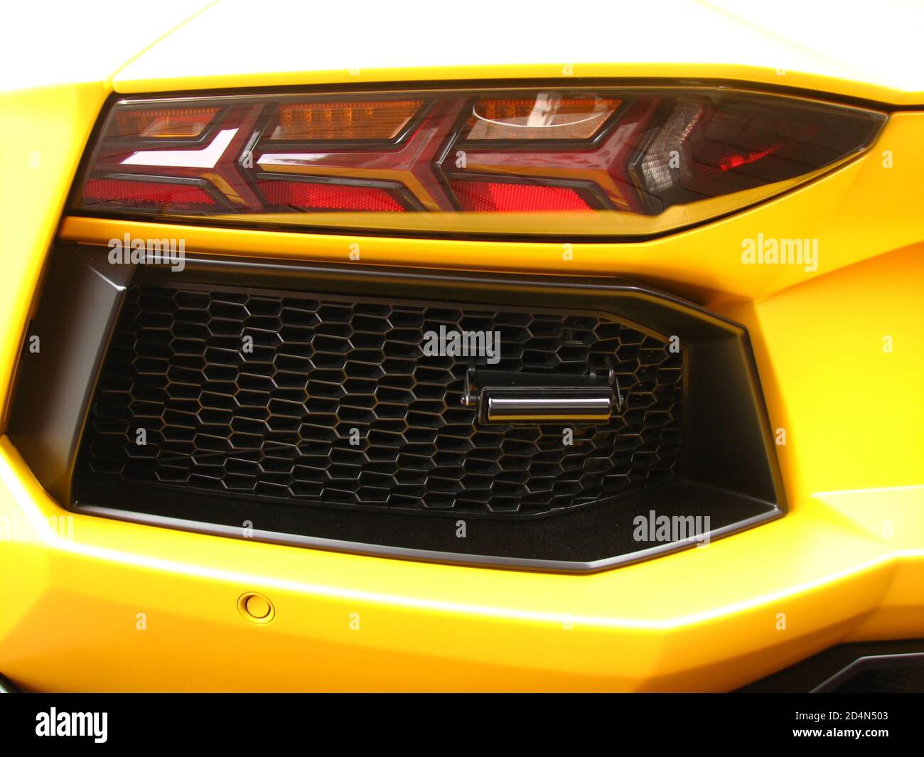 Back light of a modern yellow sport car Stock Photo - Alamy