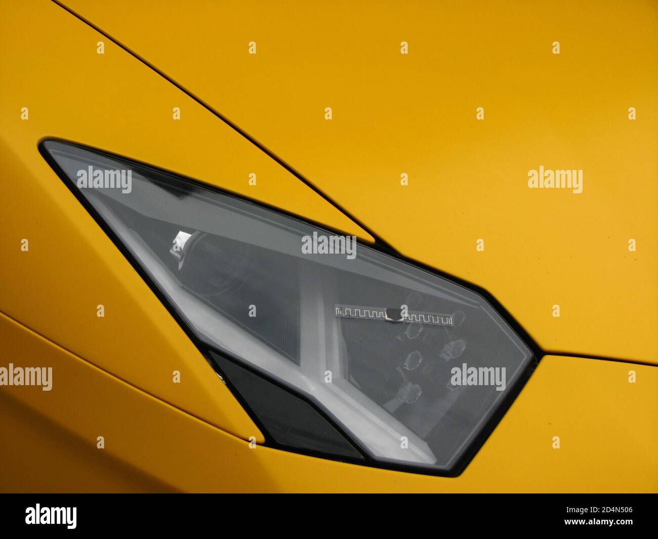 Front light of a modern yellow car Stock Photo - Alamy