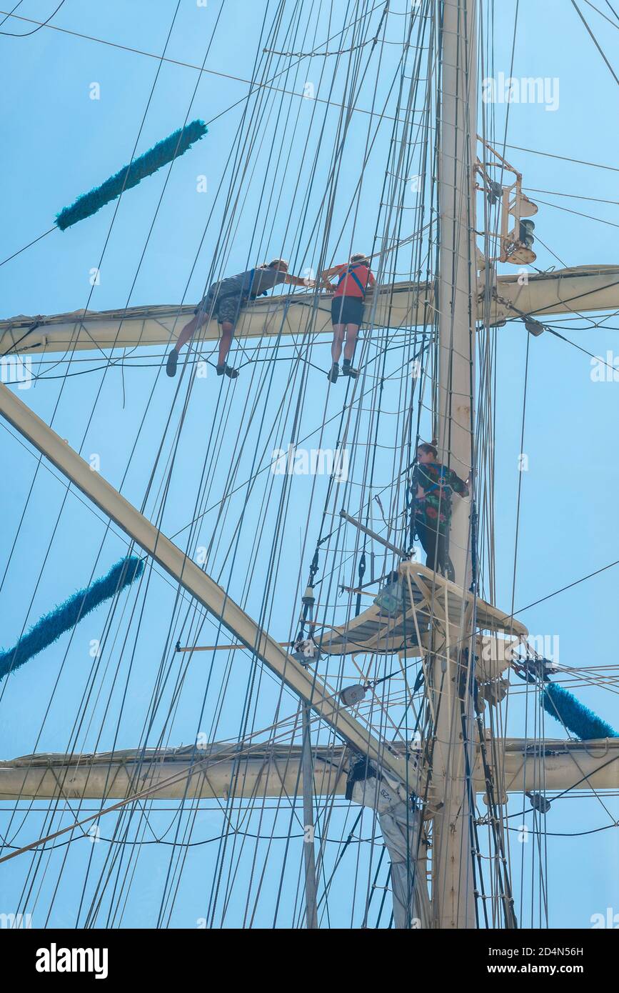 Two people in the rigging of a sailing ship Stock Photo - Alamy