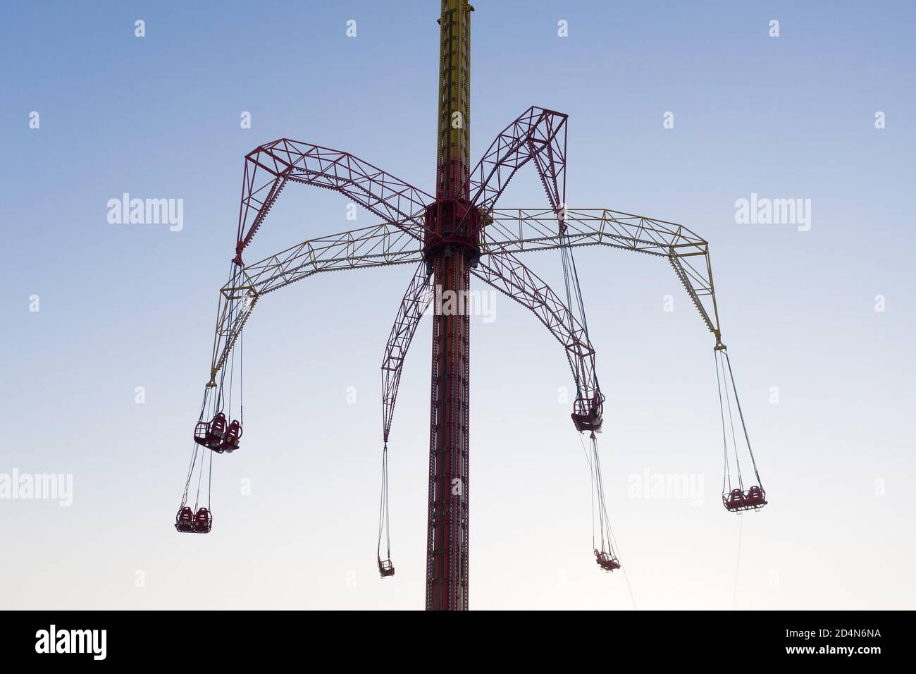 High Swing ride at an amusement park at sunrise during Covid19 second ...