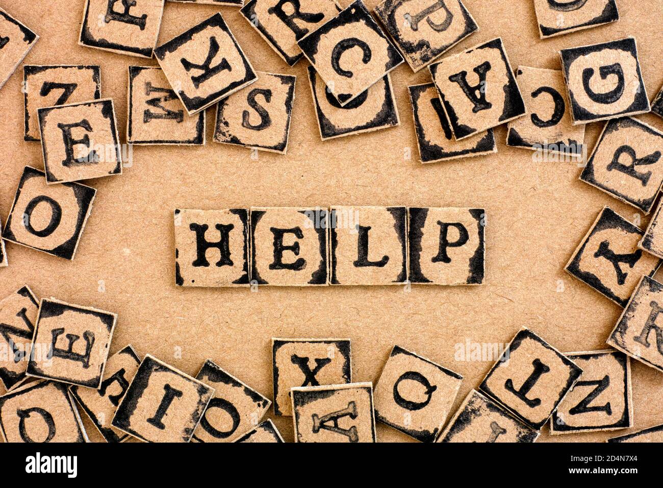 Word Help spelled out from cardboard letters made by black alphabet ...