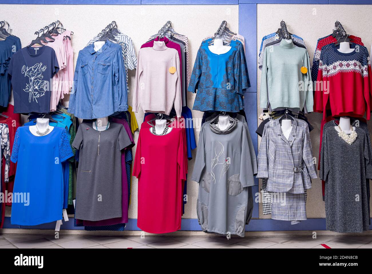 Women's clothing store. Collection of womens dress blouses dressed on ...