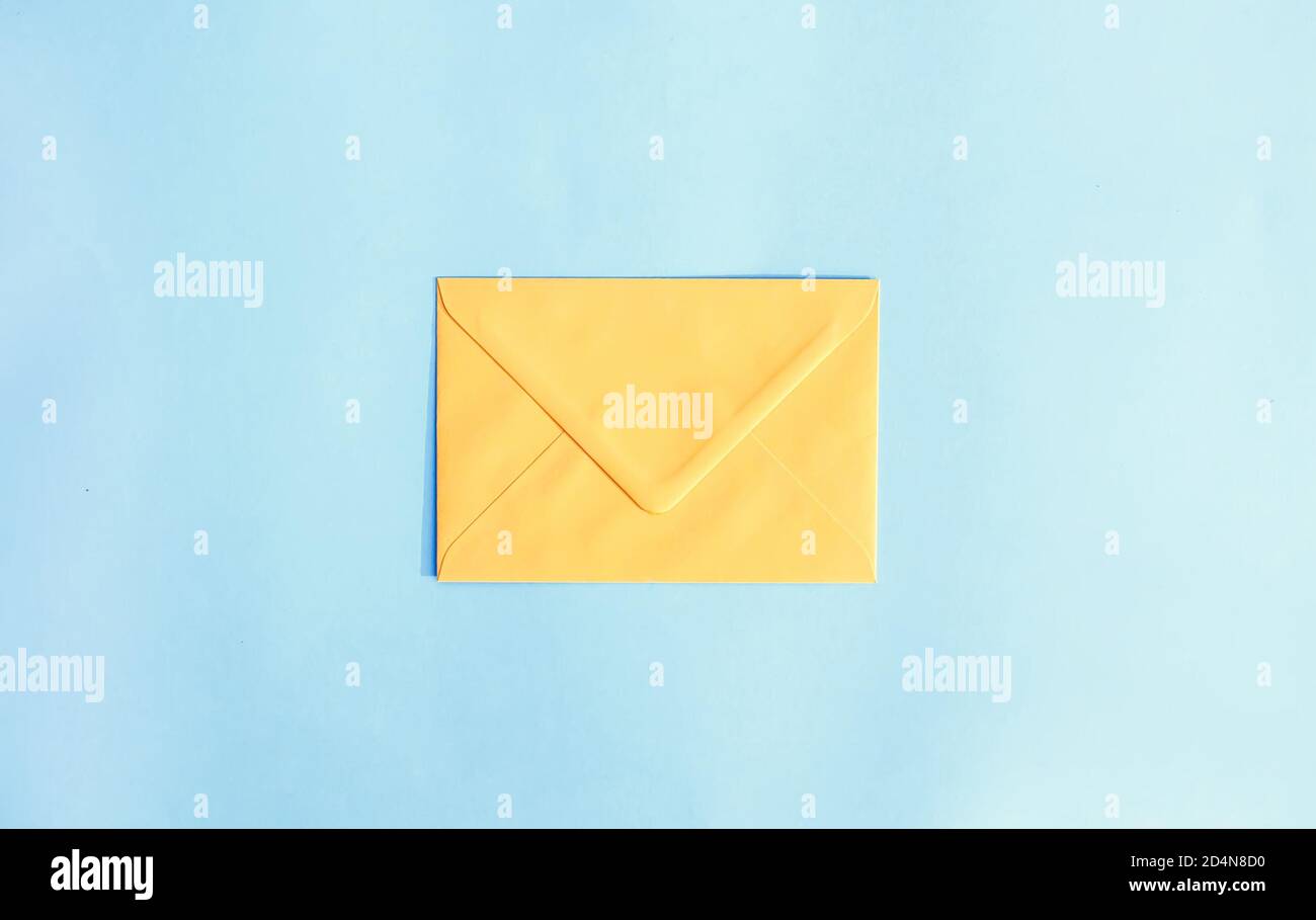 Yellow paper envelope on light blue background. Festive template ...