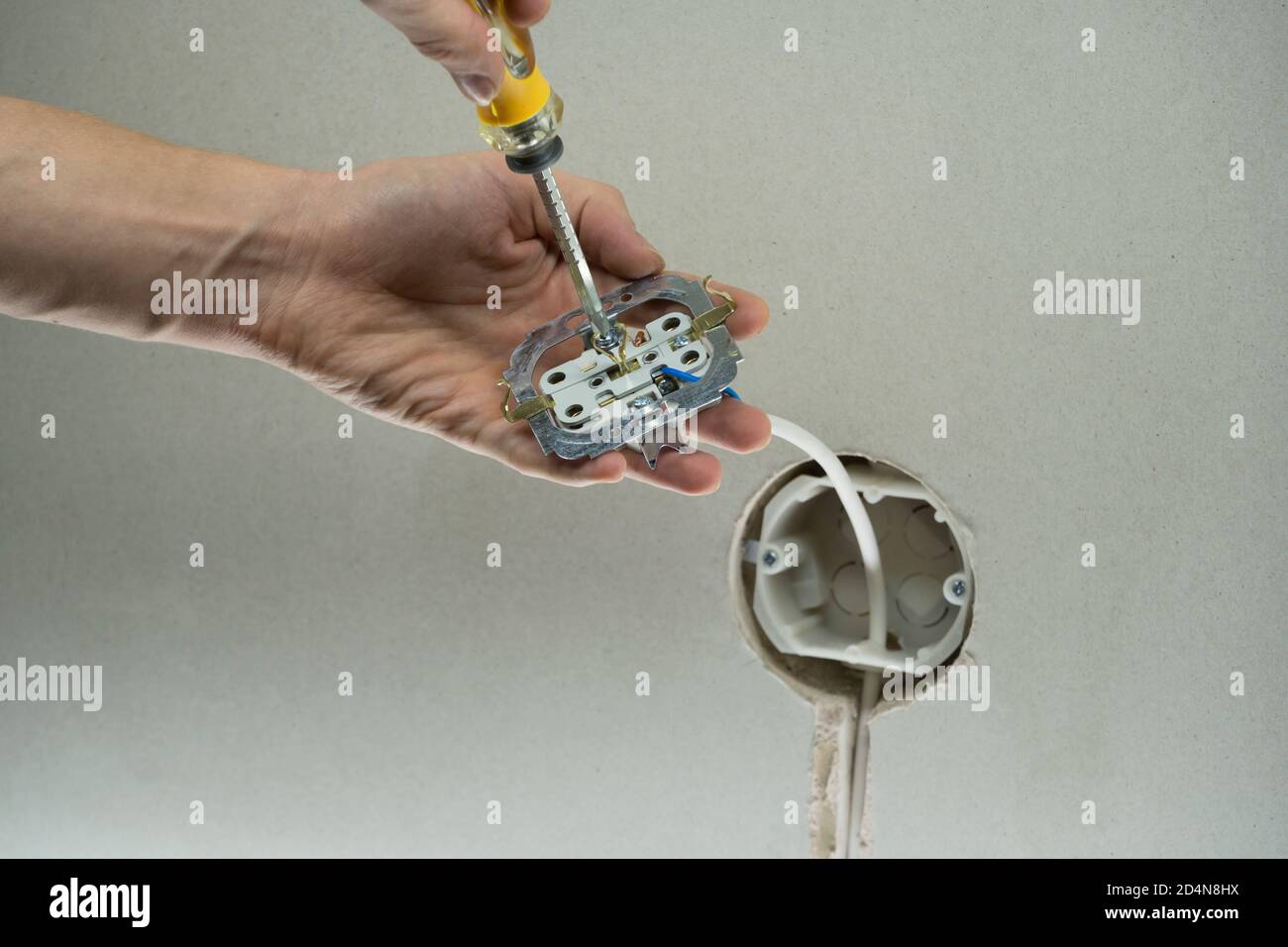 Hand holding electrical wires hi-res stock photography and images - Alamy