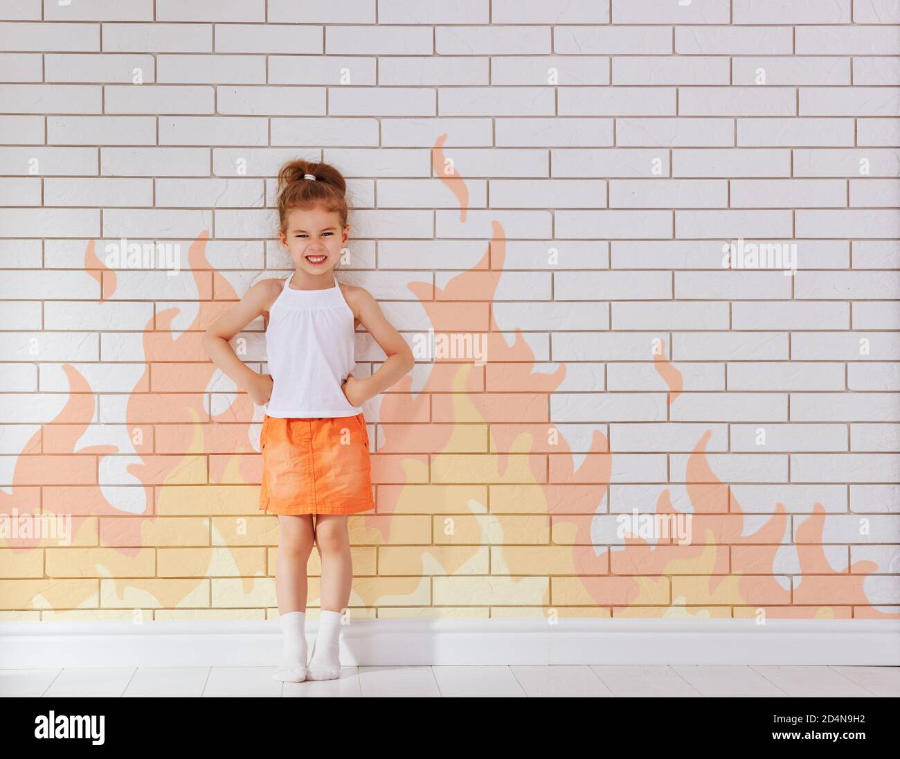 angry child on the wall background Stock Photo - Alamy