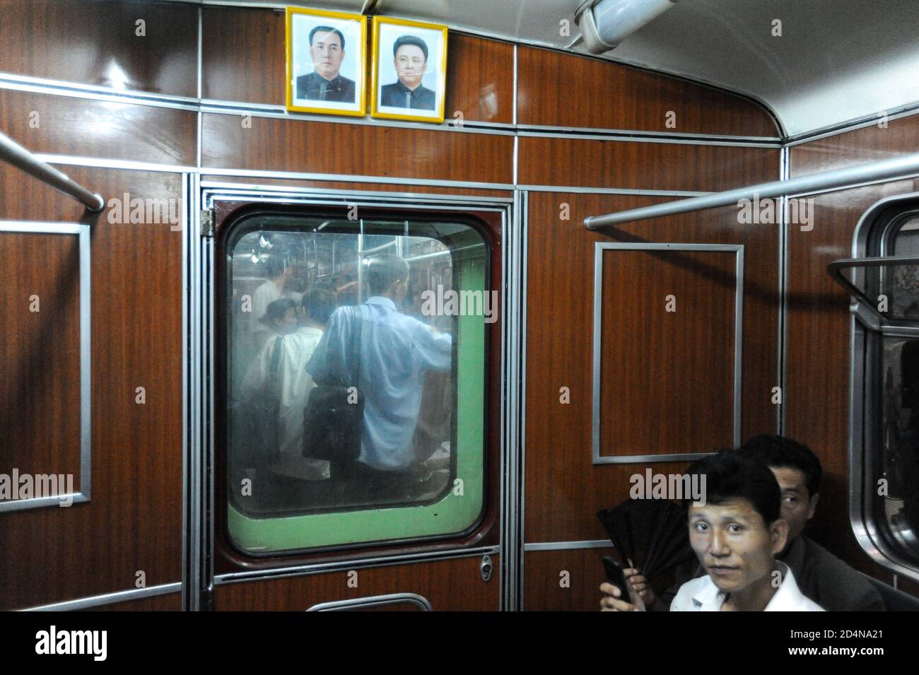 09.08.2012, Pyongyang, North Korea, Asia - Commuters inside a subway ...