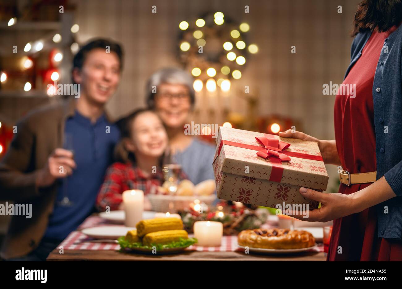 Merry Christmas! Happy family are having dinner at home. Celebration holiday and togetherness ...