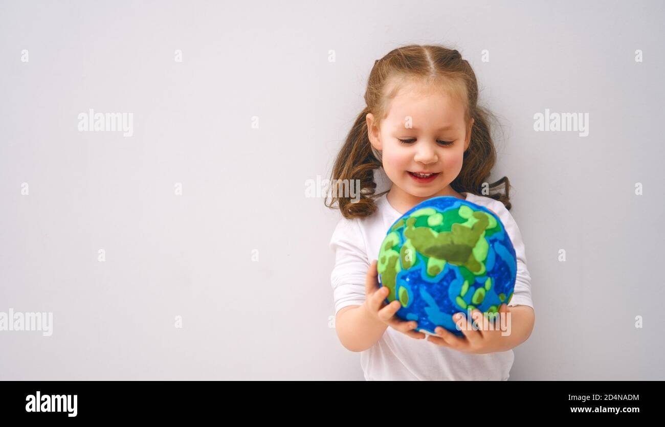 Child with globe. Happy Earth day Stock Photo - Alamy