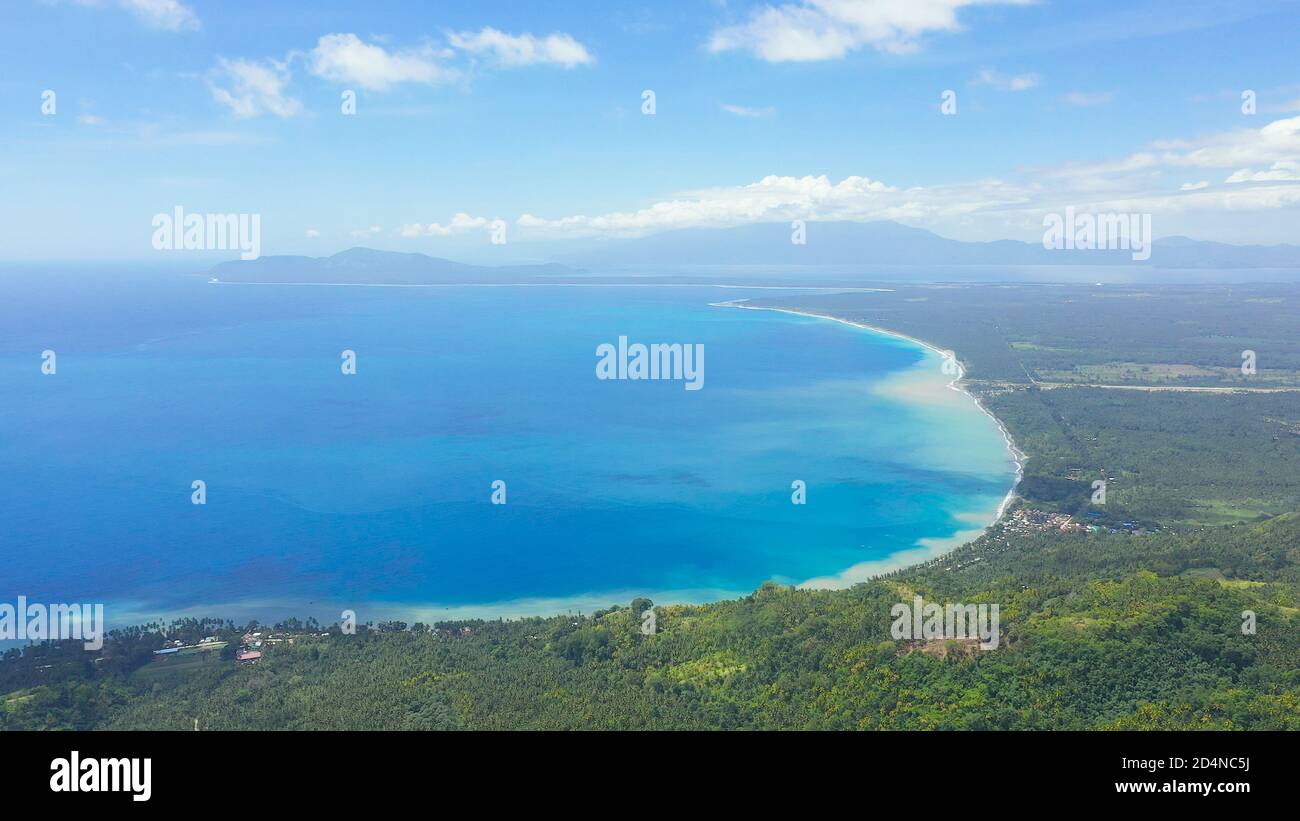 Mindanao island covered with rainforest. Blue sea and beaches in the ...