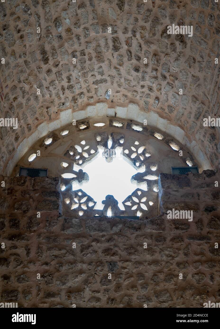 Cross-shaped church window of St. Pierre Church in antique city of ...