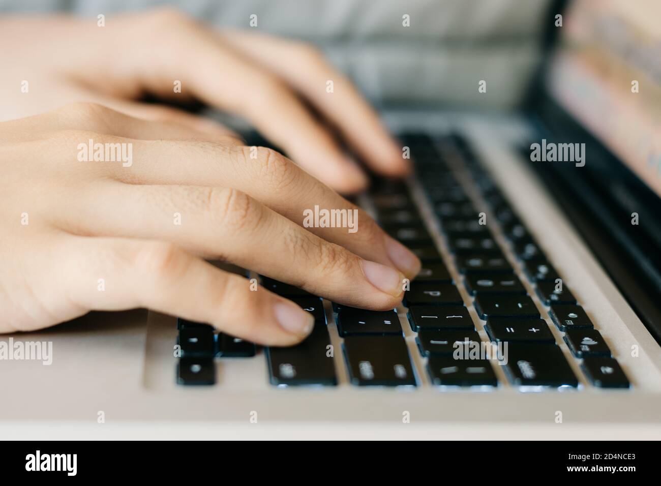hands typing on a keyboard Stock Photo - Alamy