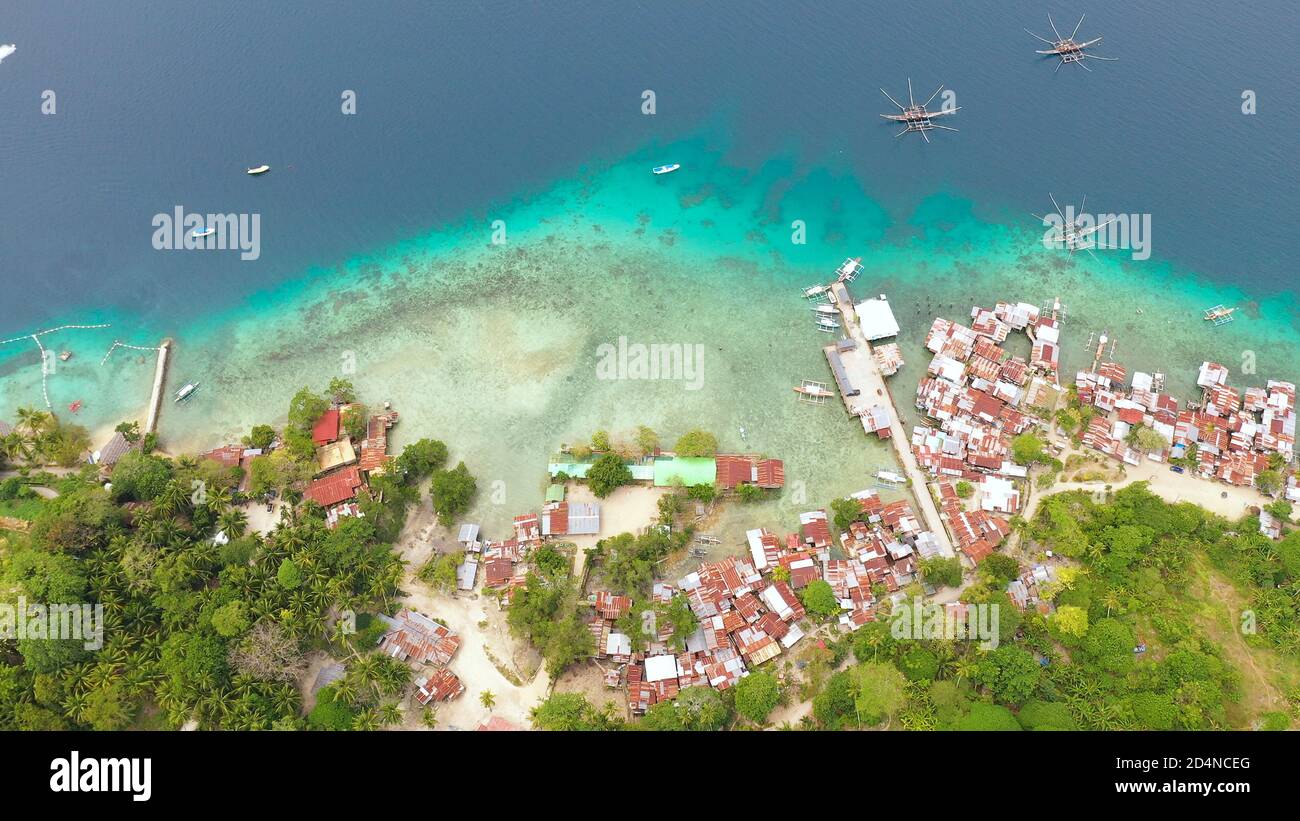 Aerial view of village of fishermen with houses on the water, with ...