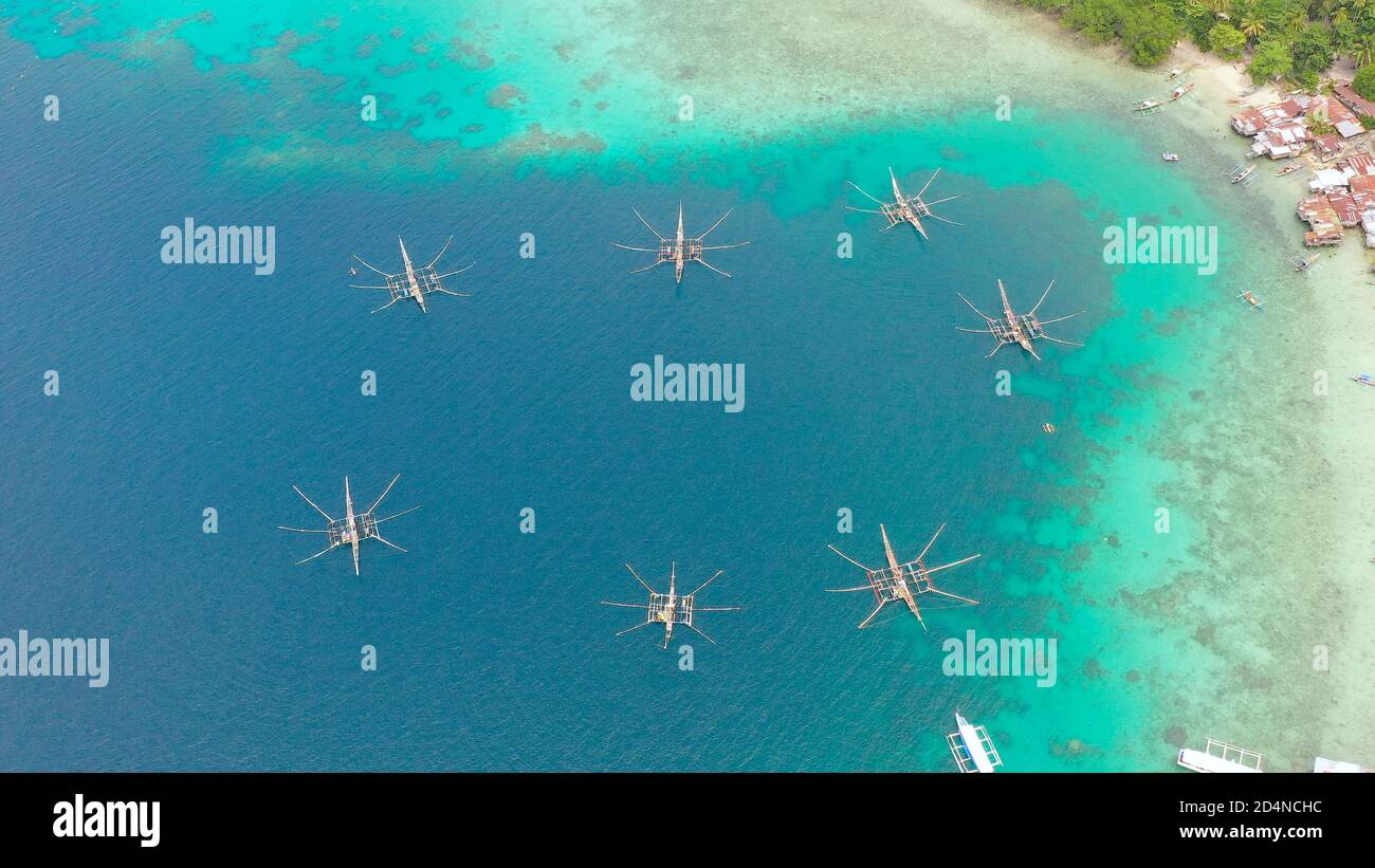 Aerial view of village of fishermen with houses on the water, with ...