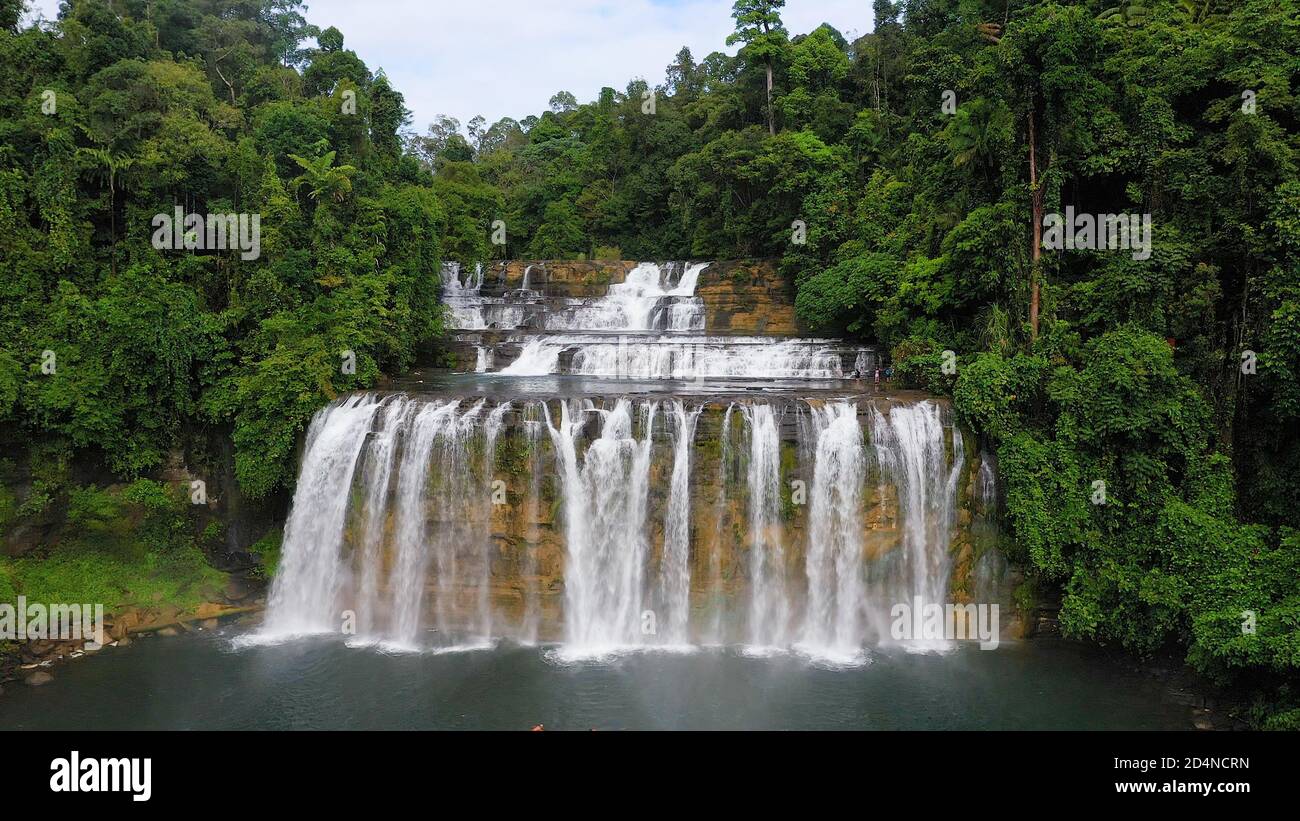 Beautiful waterfall in green forest, top view. Tropical Tinuy-an Falls ...