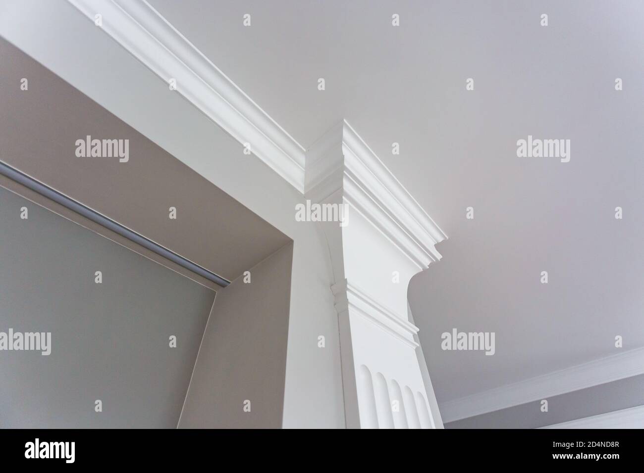 Detail of corner ceiling with intricate crown molding Stock Photo - Alamy